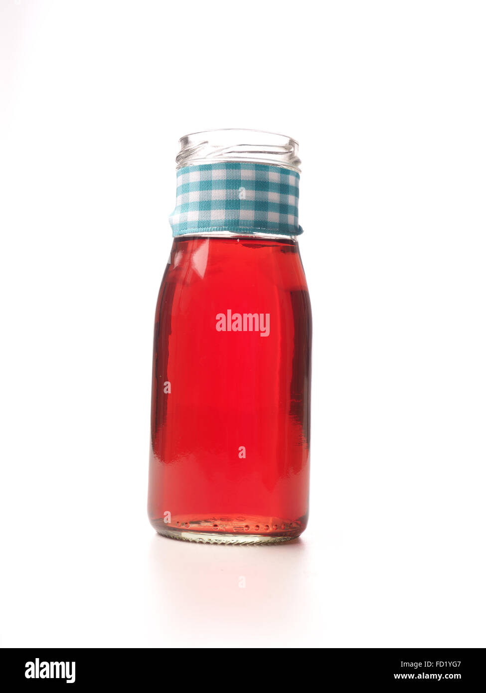Bottle of red juice on a white background Stock Photo - Alamy
