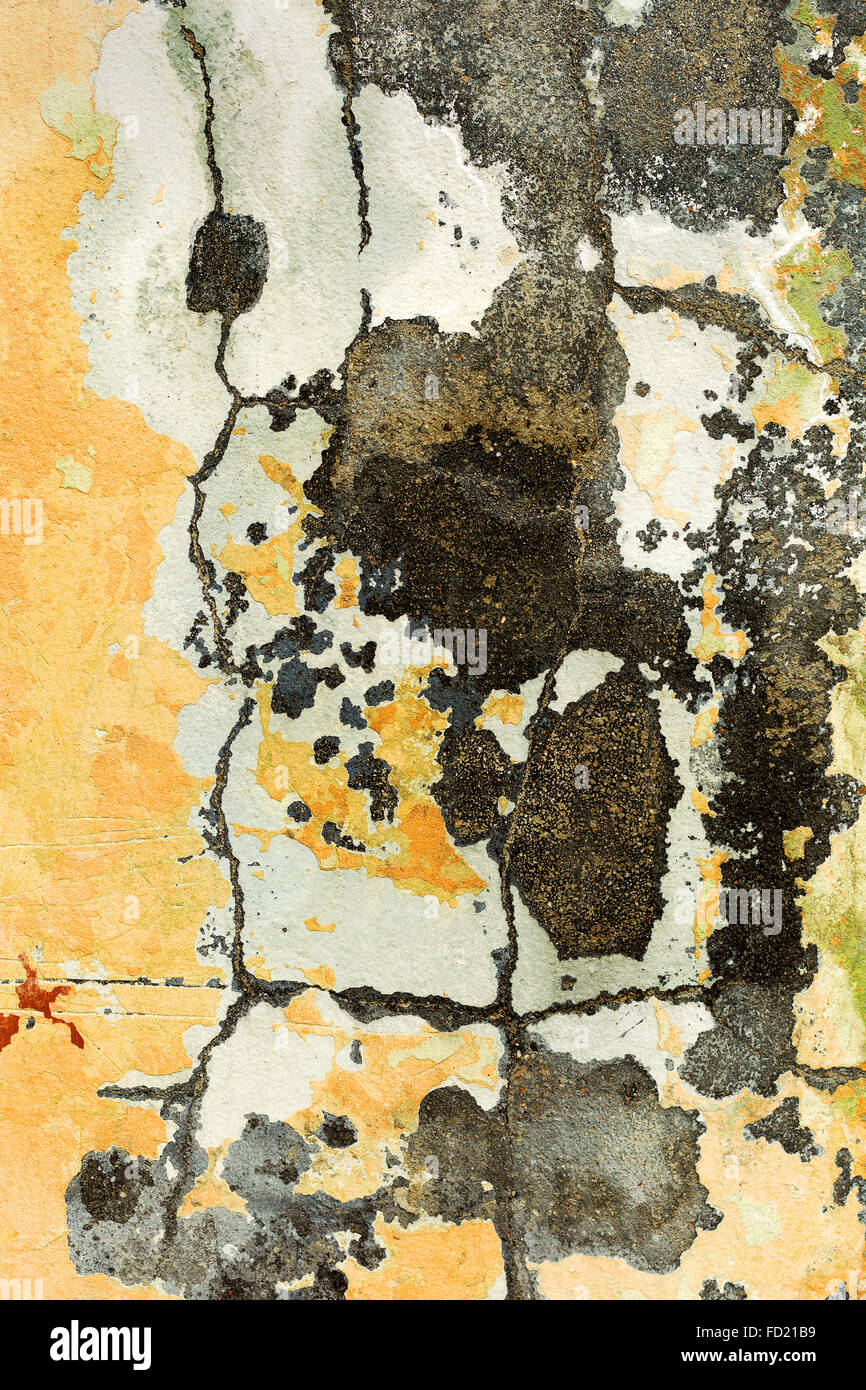 Dirty concrete wall with streaks of water, stains, cracks and scratches ...