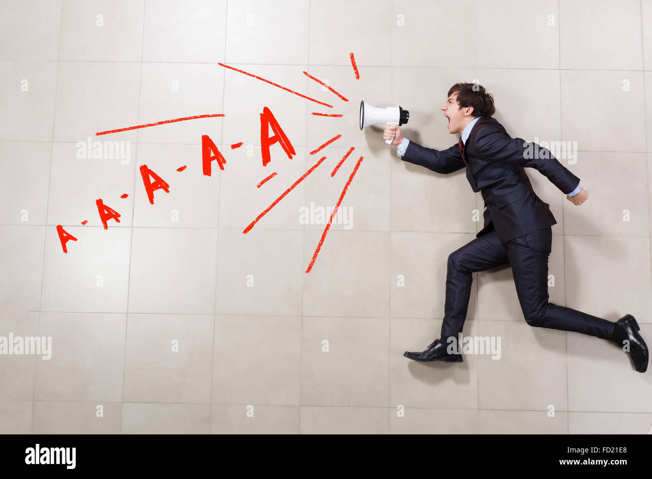 Young businessman running with megaphone in hand Stock Photo - Alamy