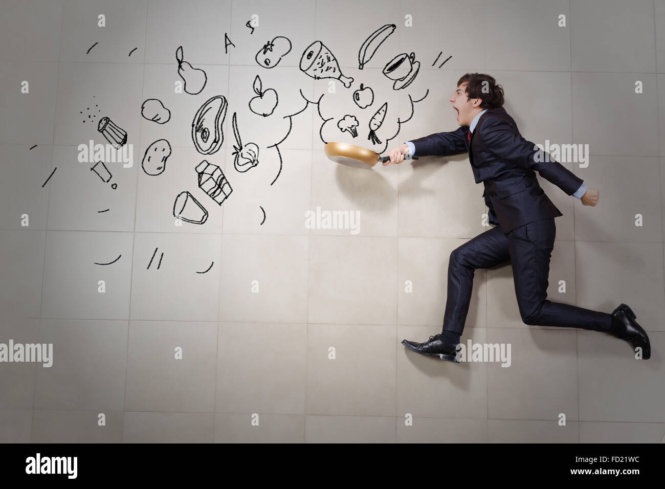 Young funny businessman running with pan in hand Stock Photo - Alamy