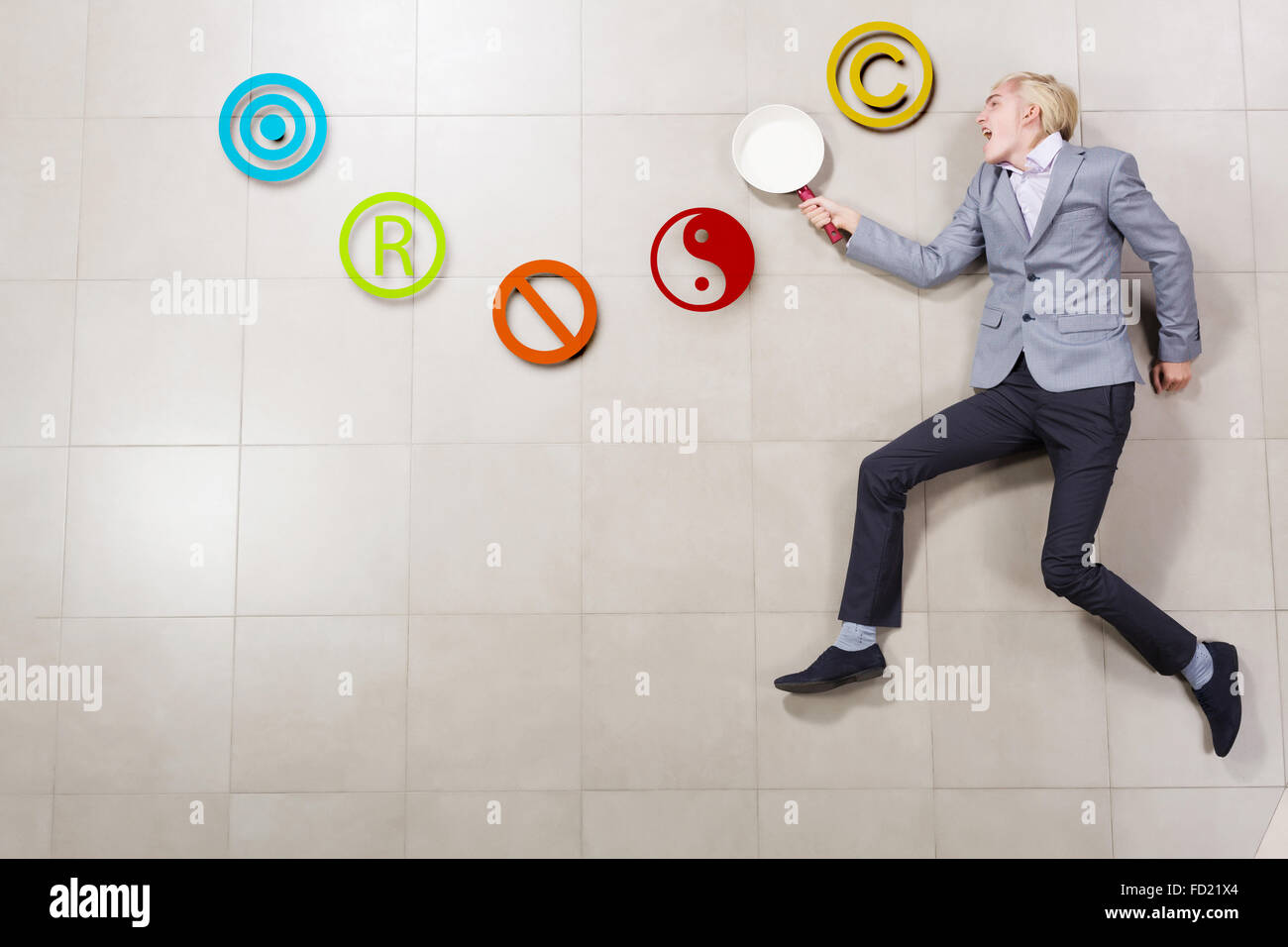 Young funny businessman running with pan in hand Stock Photo - Alamy