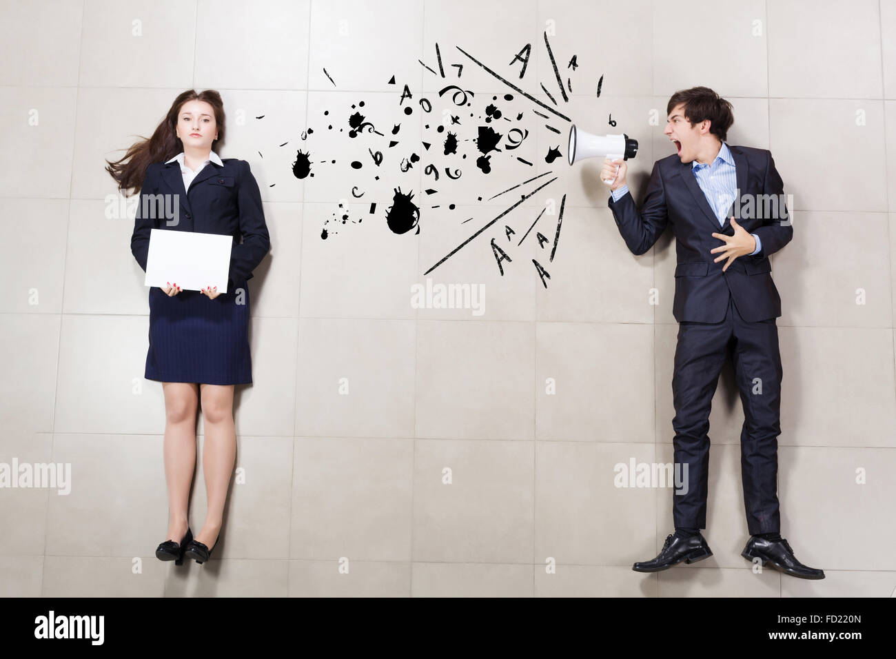 Aggressive businessman shouting at colleague with megaphone Stock Photo ...