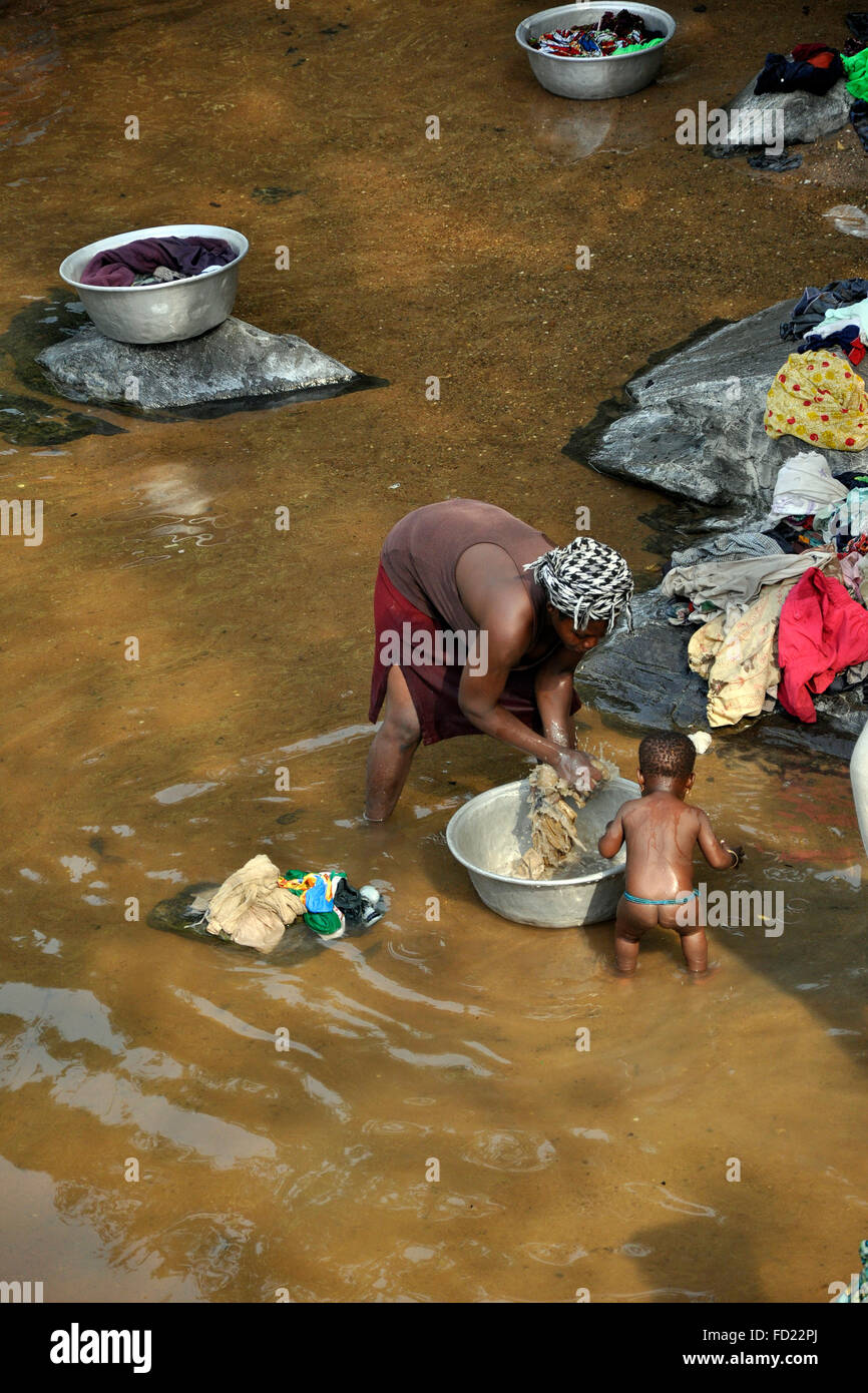 Togo, surrounding of Lomè, washing in the river Stock Photo - Alamy