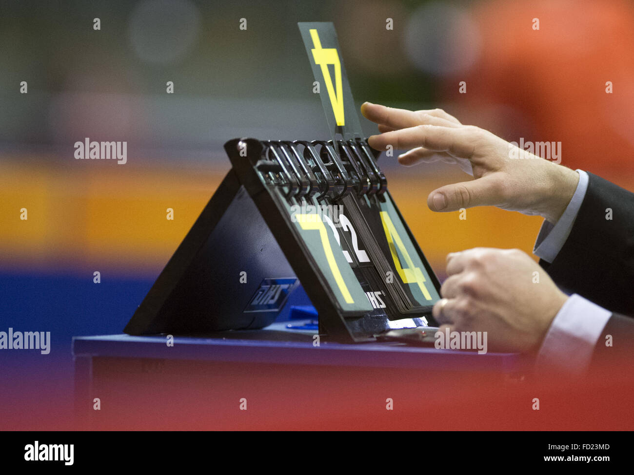A referee changes the scoreboard after a point during the German Open ...