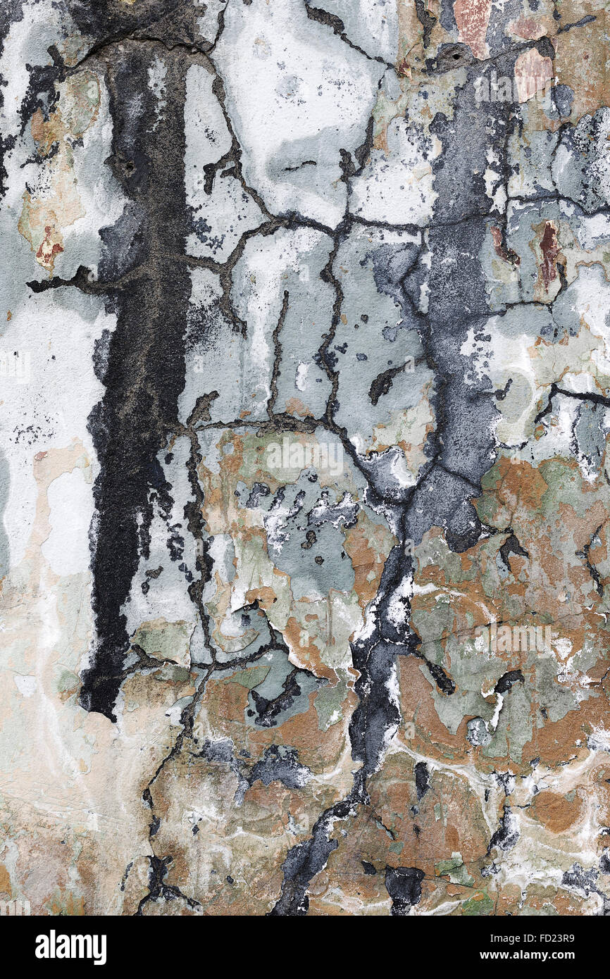 Dirty concrete wall with streaks of water, stains, cracks and scratches ...