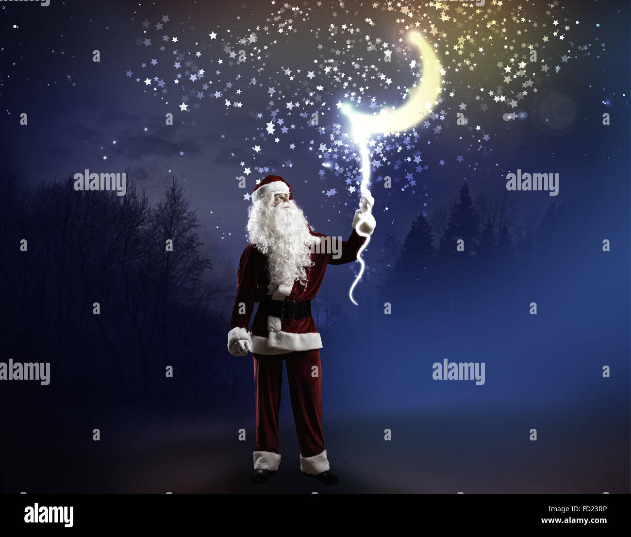 Santa Claus holding moon in night sky on rope Stock Photo - Alamy