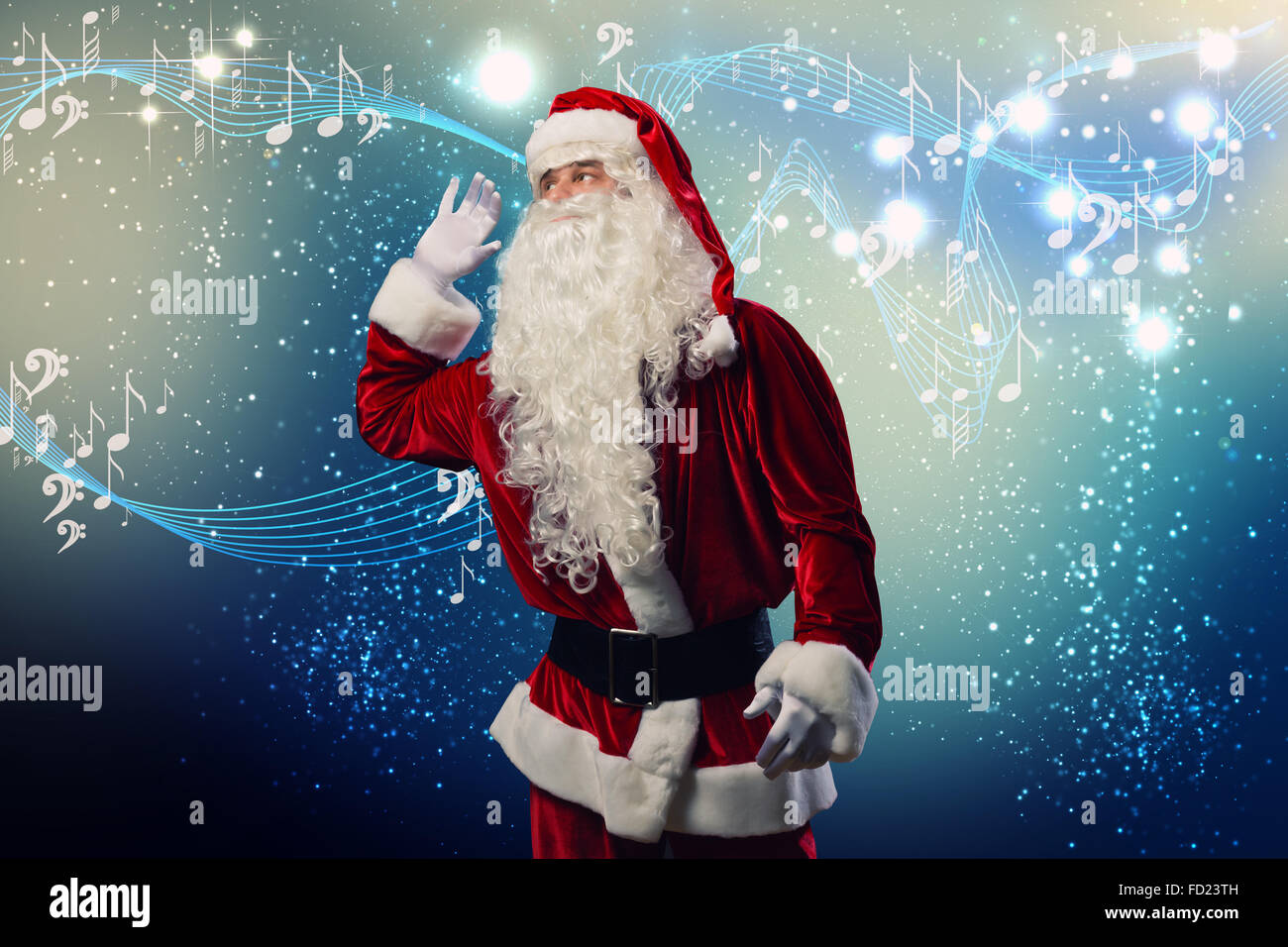 Santa Claus enjoying sound of distant music Stock Photo - Alamy