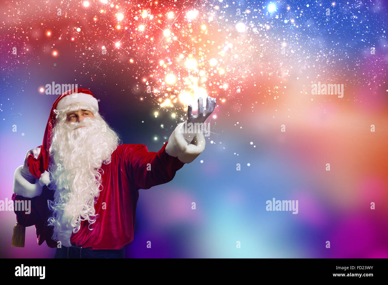 Santa Claus with gift bag behind shoulders Stock Photo - Alamy