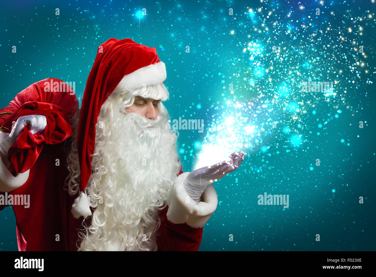 Santa Claus with gift bag behind shoulders Stock Photo - Alamy