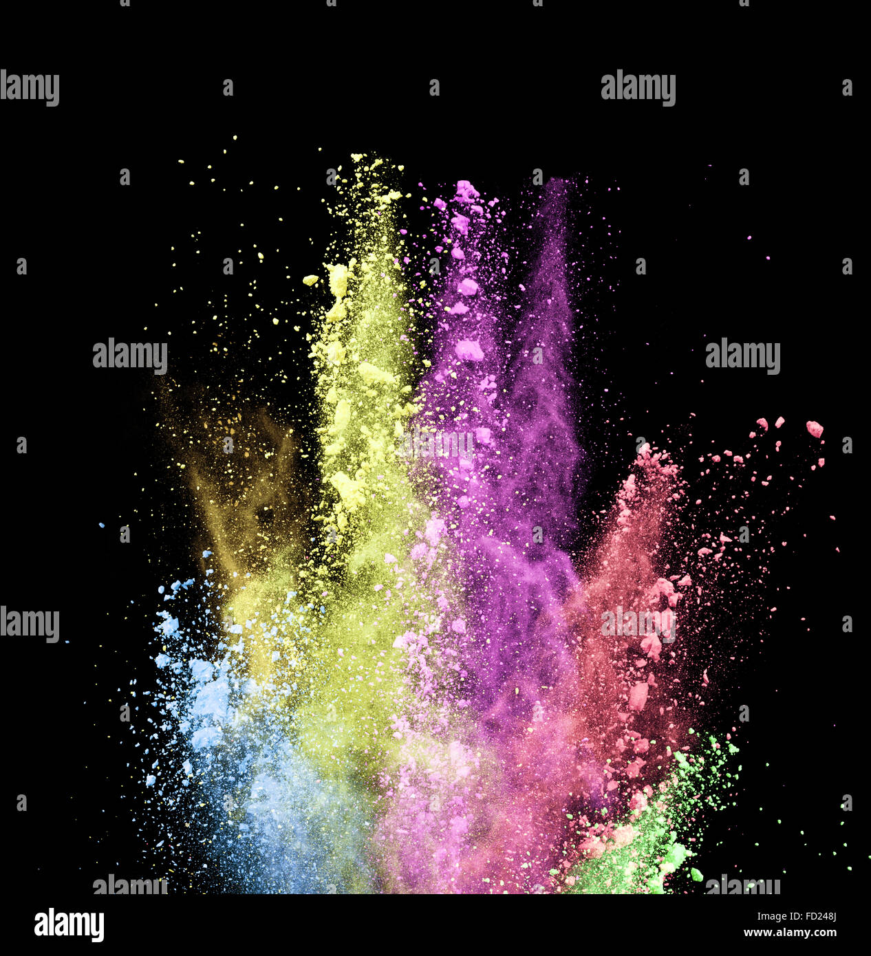 Colored powder explosion isolated on black background Stock Photo - Alamy