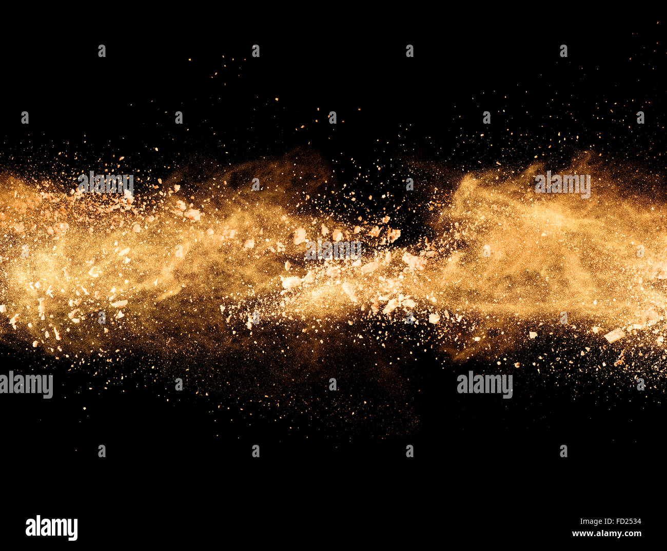Explosion of orange powder, isolated on black background Stock Photo ...