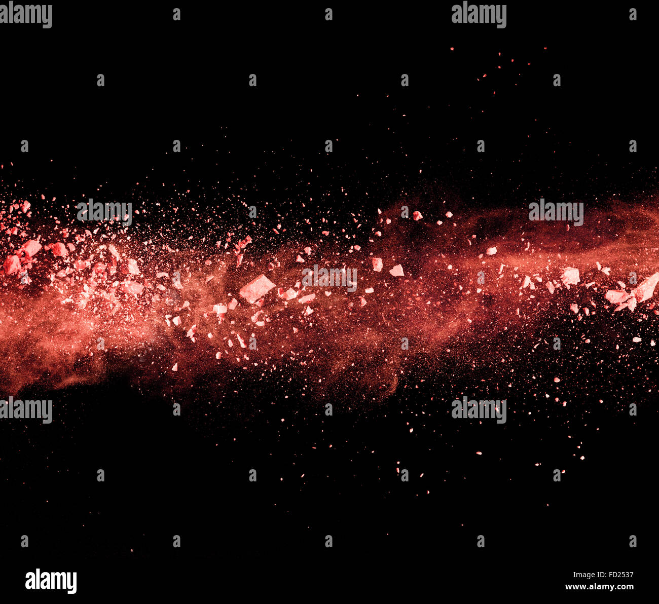 Explosion of red powder, isolated on black background Stock Photo - Alamy
