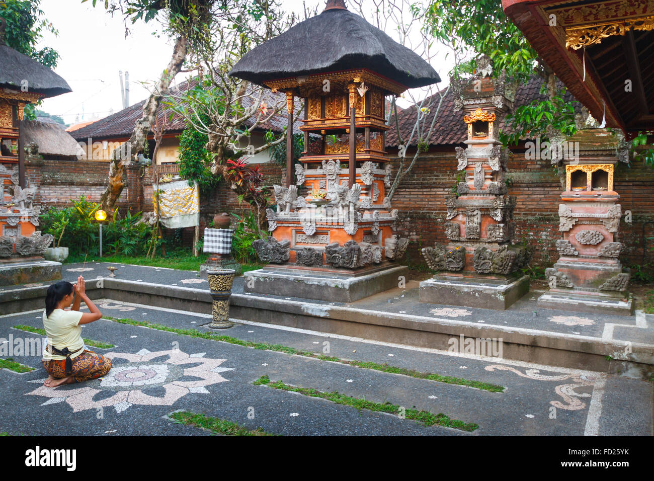 Woman praying in temple hi-res stock photography and images - Alamy