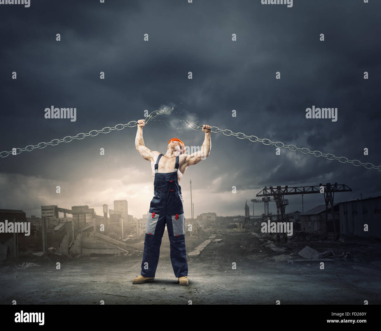 Strong man in uniform tearing metal chain with hands Stock Photo - Alamy