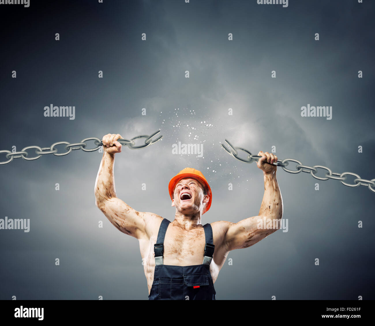 Strong man in uniform tearing metal chain with hands Stock Photo - Alamy