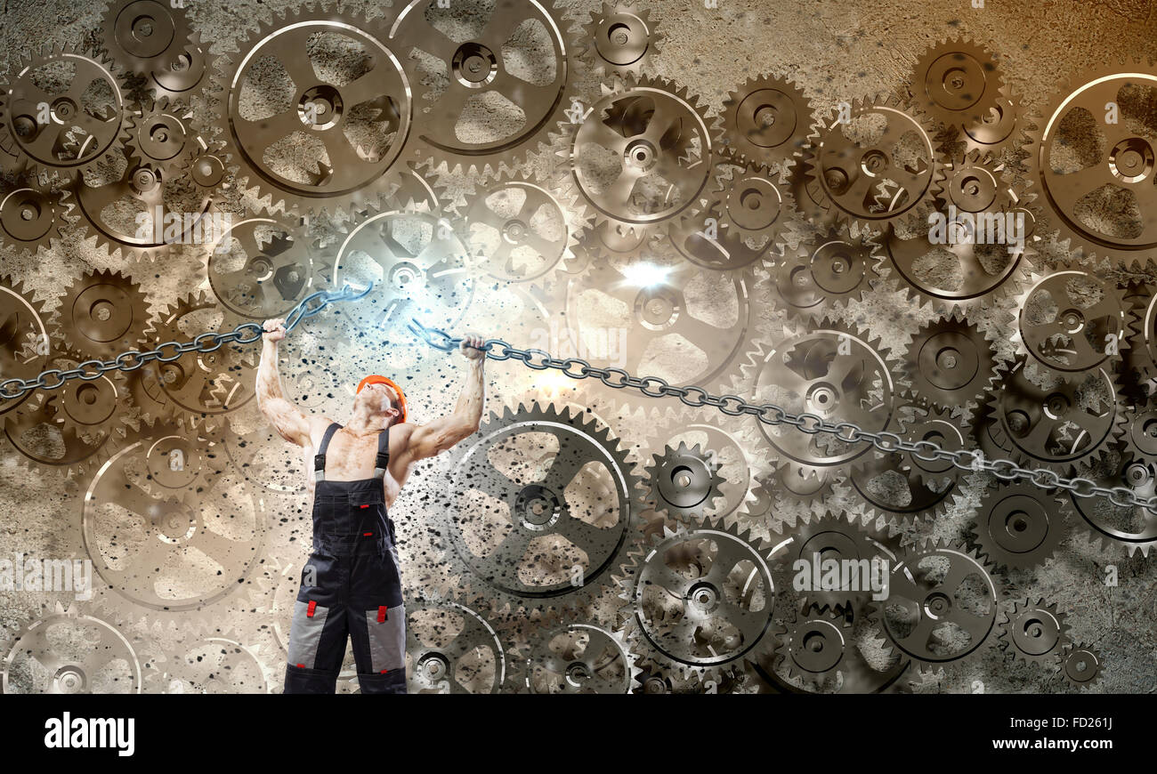 Strong man in uniform tearing metal chain with hands Stock Photo - Alamy