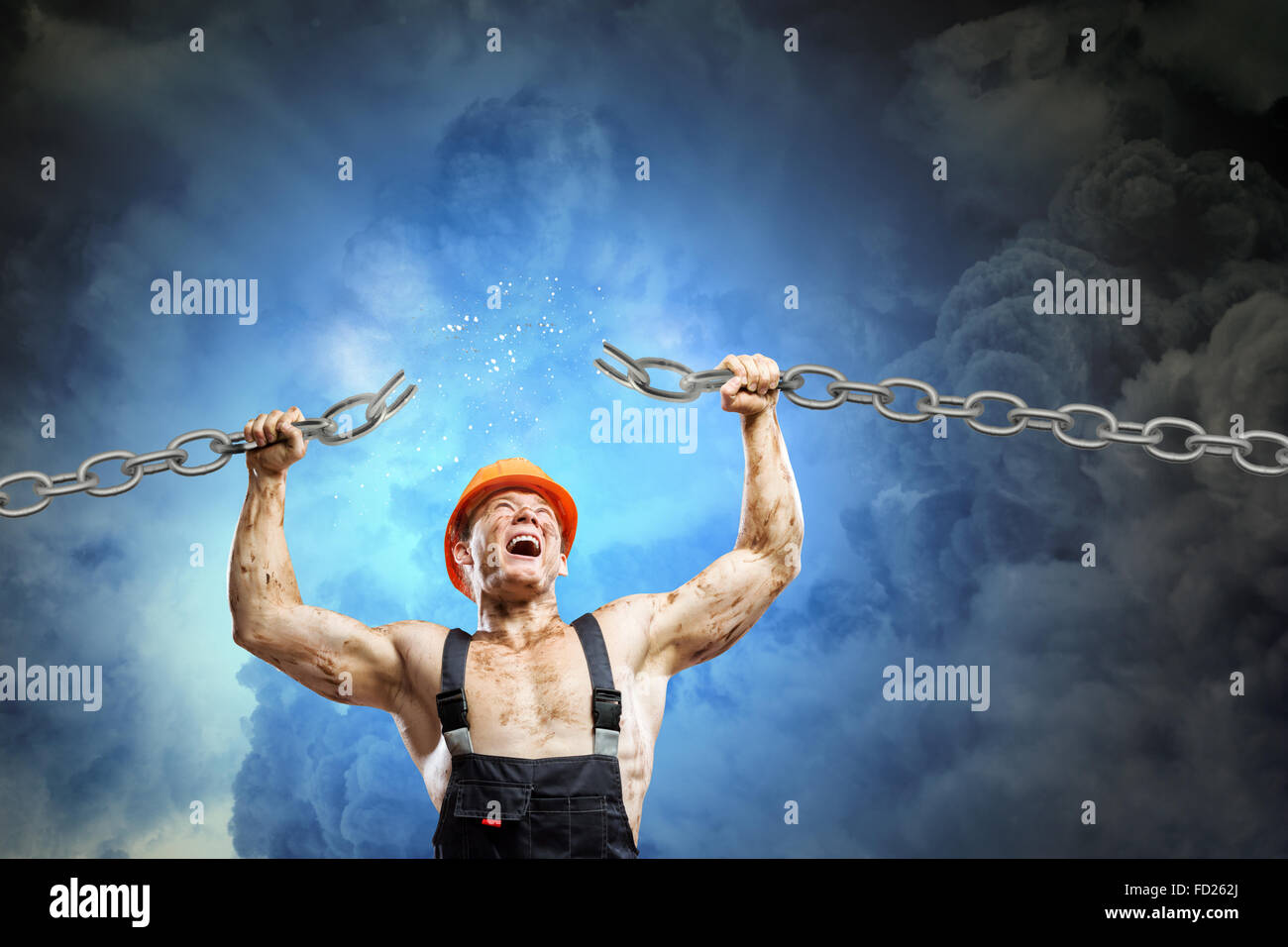 Strong man in uniform tearing metal chain with hands Stock Photo - Alamy