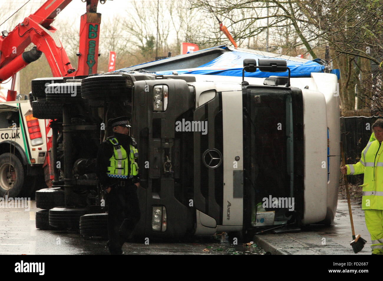 Swindon, England. 27th January, 2016. Recovery teams work to remove the ...