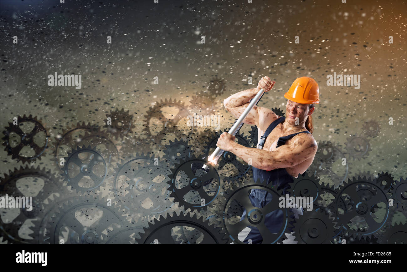 Strong man mechanic in uniform with spanner fixing mechanism Stock ...