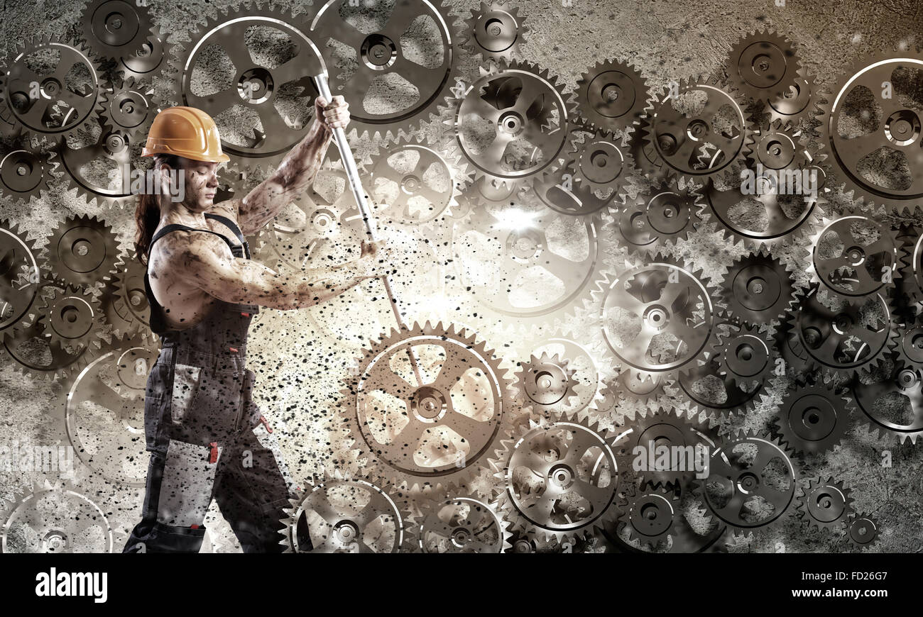 Strong man mechanic in uniform with spanner fixing mechanism Stock ...