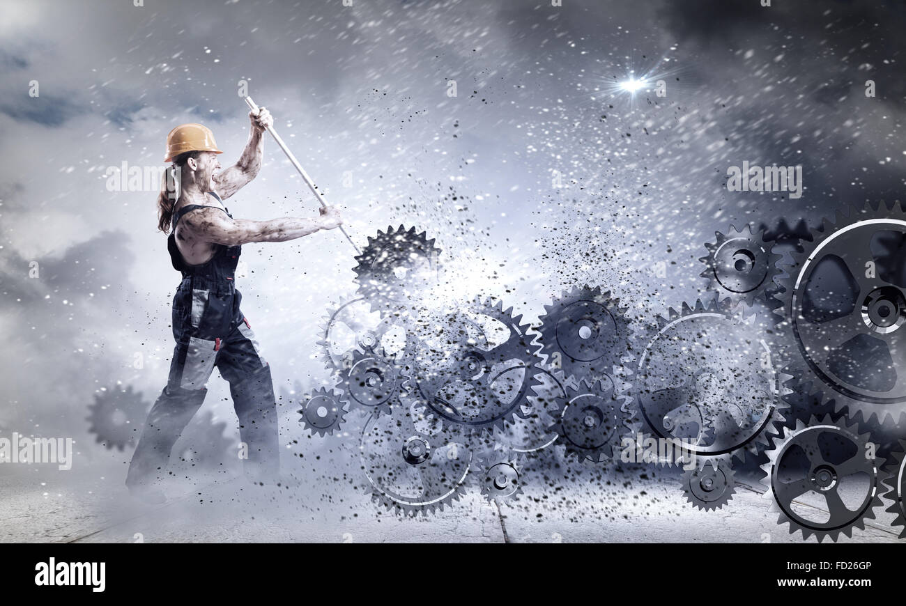Strong man mechanic in uniform with spanner fixing mechanism Stock ...