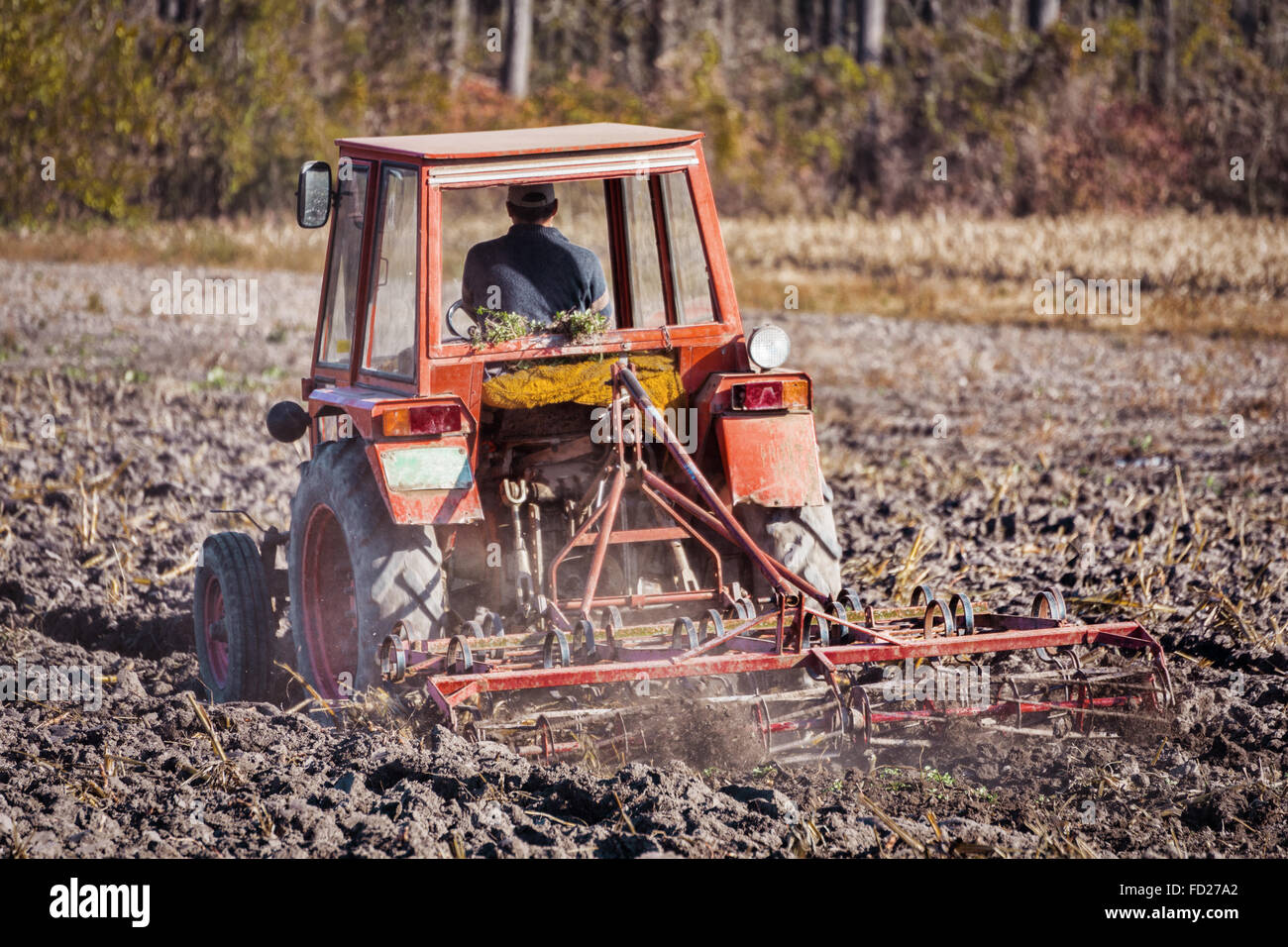 Farmer in Tractor Preparing Land for Sowing, Agriculture and Working ...