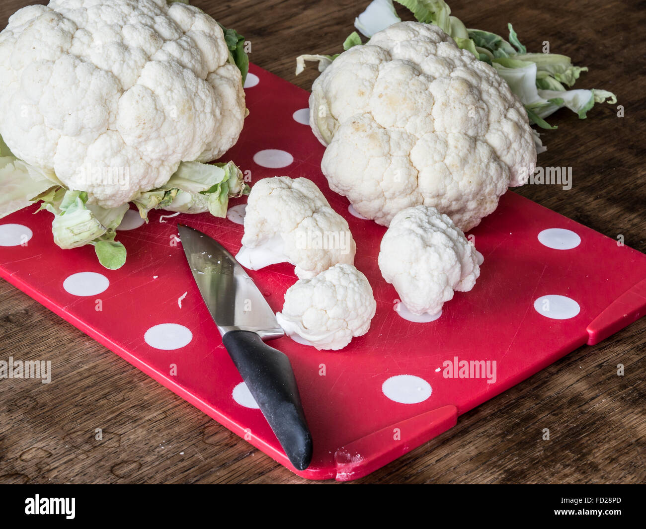 Cauliflower being chopped Stock Photo - Alamy