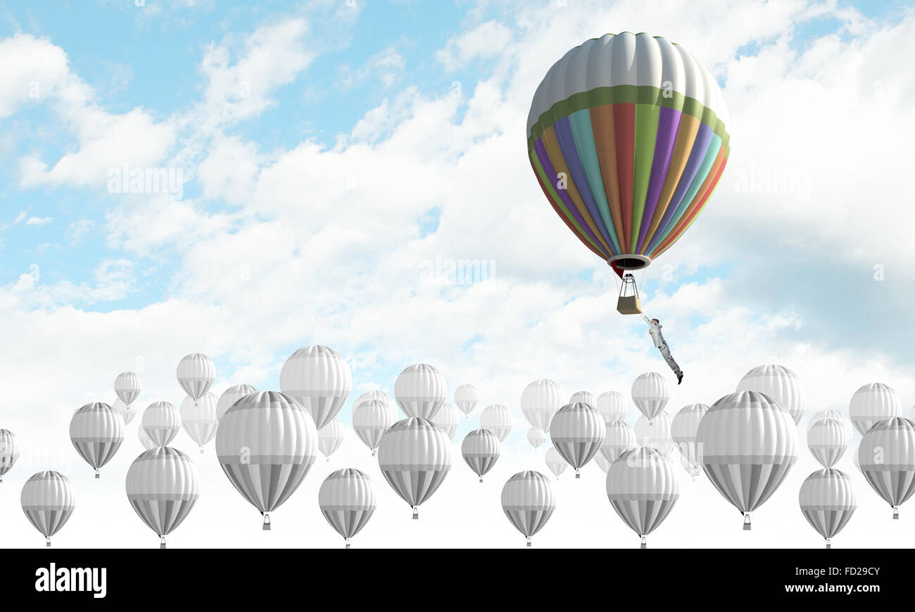 Conceptual image with balloons flying high in sky Stock Photo - Alamy
