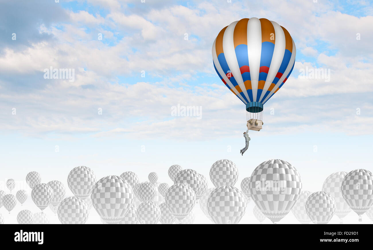 Conceptual image with balloons flying high in sky Stock Photo - Alamy