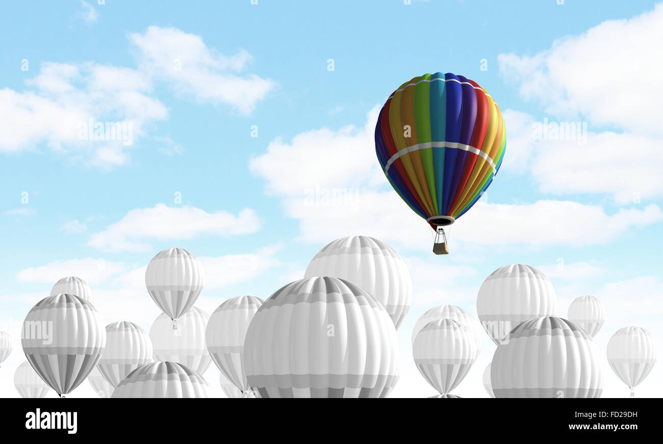 Conceptual image with balloons flying high in sky Stock Photo - Alamy