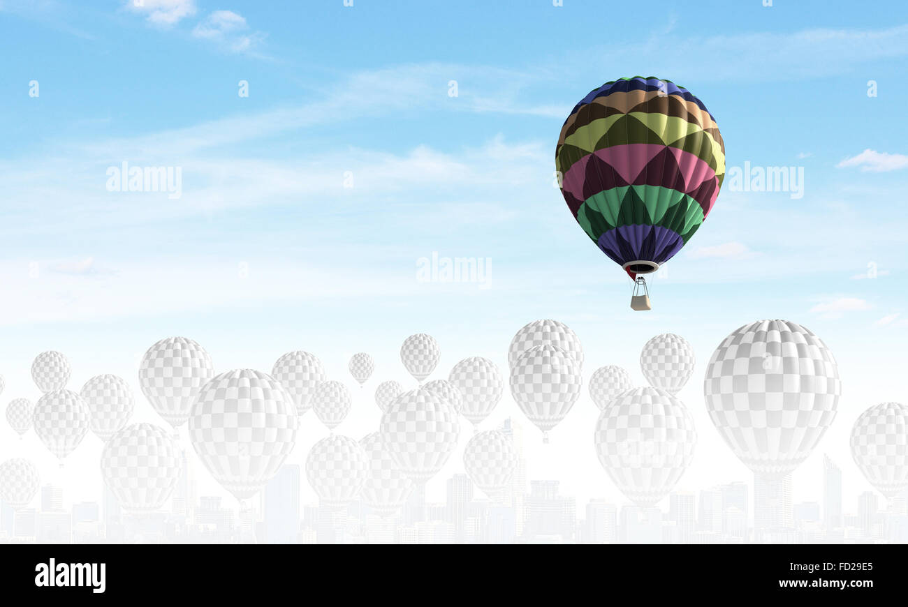 Conceptual image with balloons flying high in sky Stock Photo - Alamy