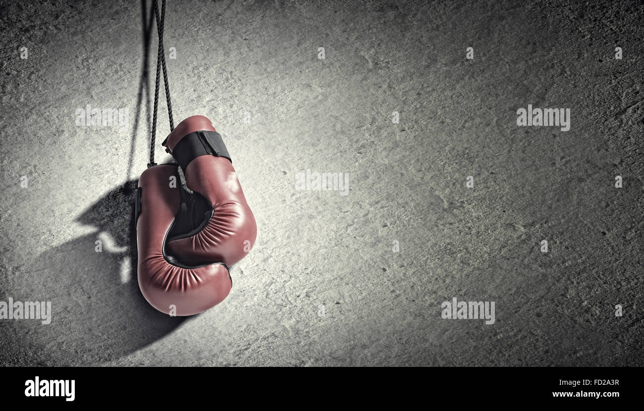Pair of red boxing gloves hanging on wall Stock Photo - Alamy