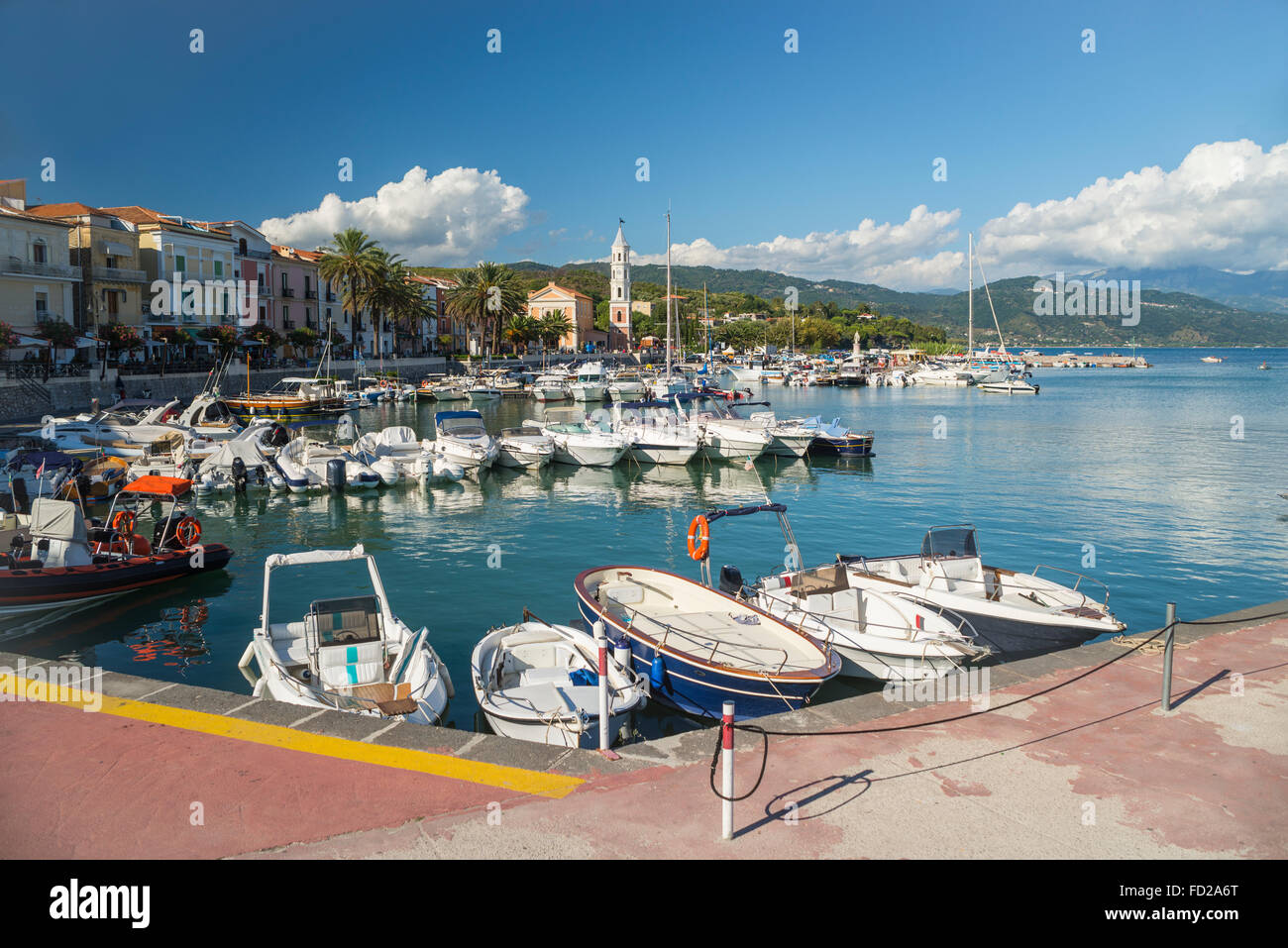 Motor boats and yachts in the harbor of Scario on a sunny summer day in ...