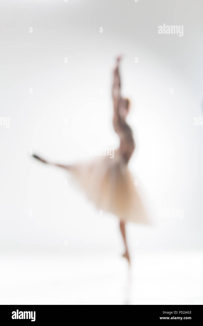 Blurred silhouette of ballerina dancing on white background Stock Photo ...