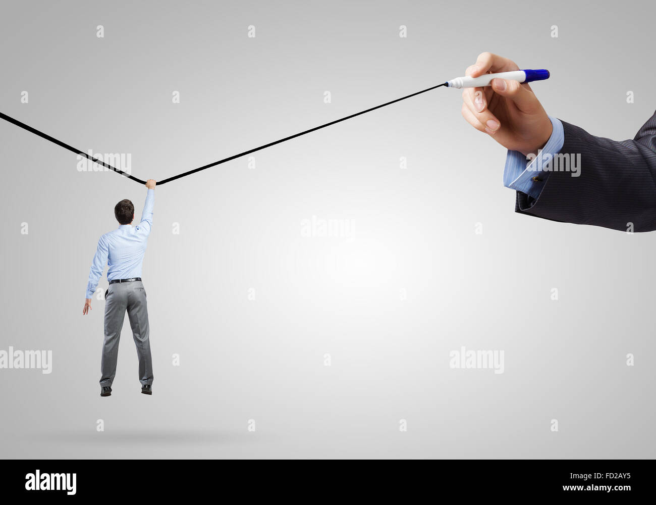 Rear view of businessman hanging on drawn line Stock Photo - Alamy