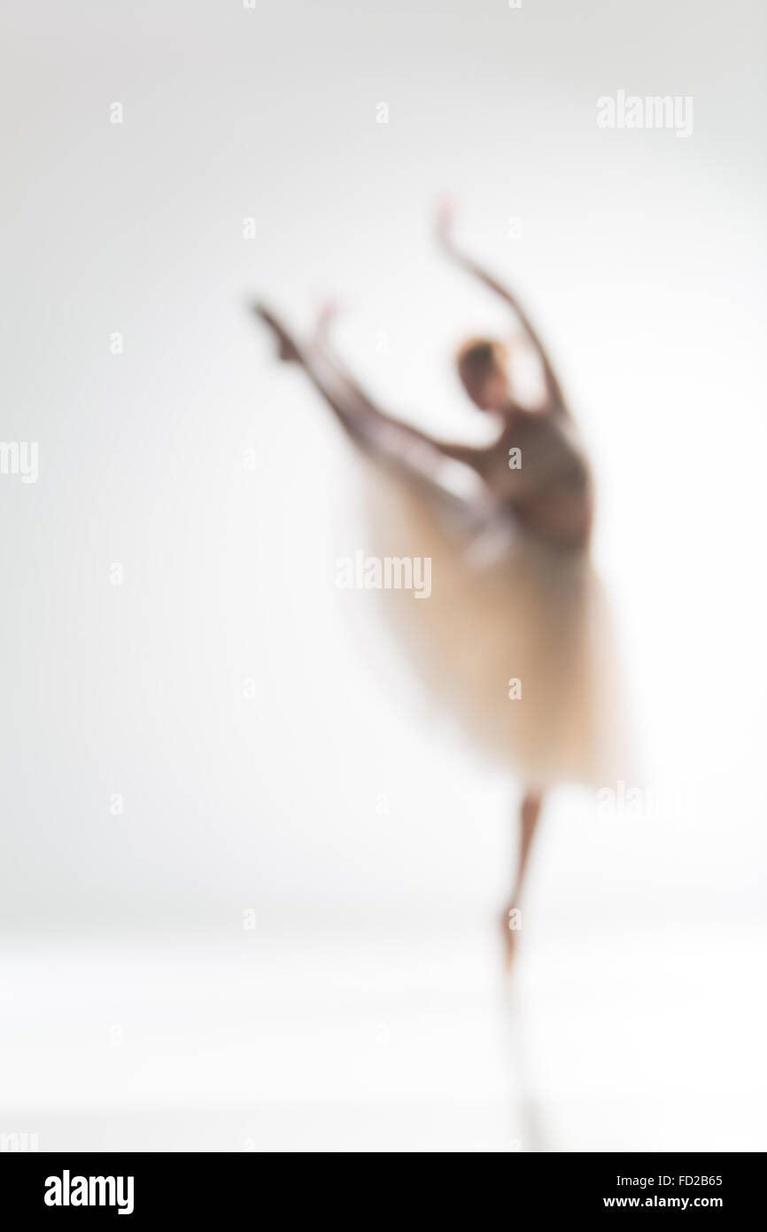 Blurred silhouette of ballerina dancing on white background Stock Photo ...