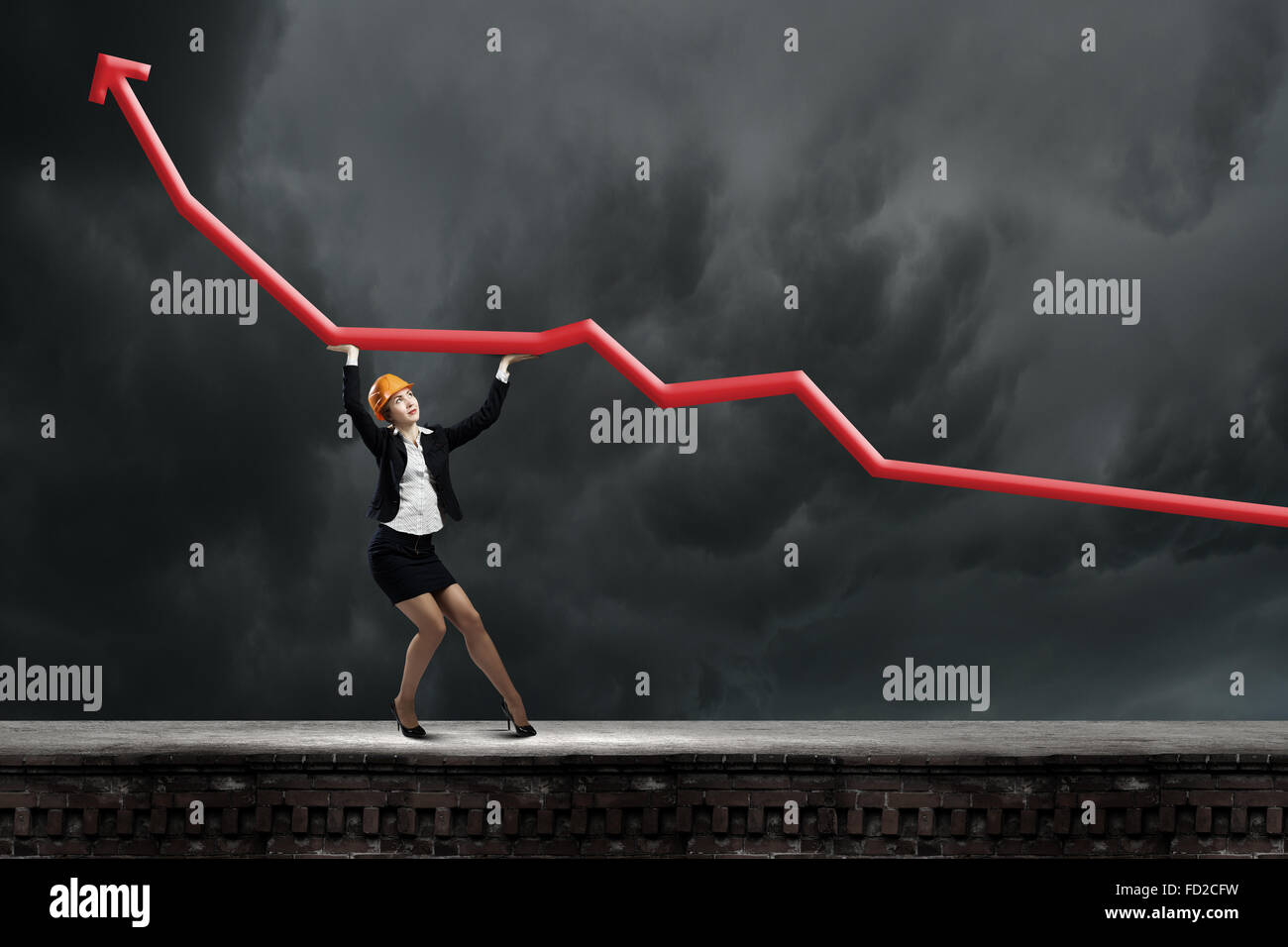 Young woman in hardhat holding red increasing graph Stock Photo - Alamy