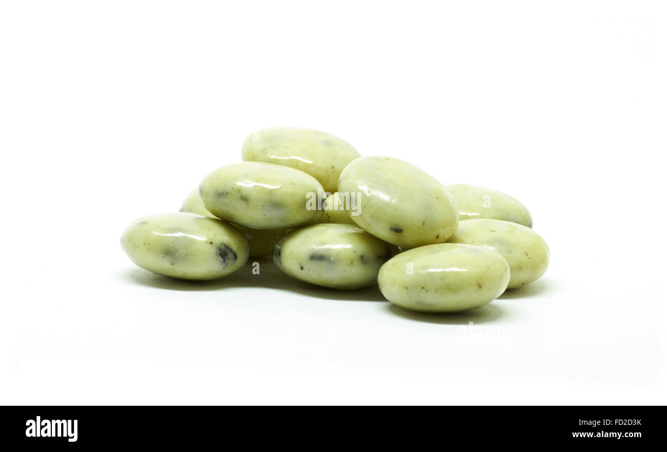 Isolated white chocolate drops with pieces of cookie Stock Photo - Alamy