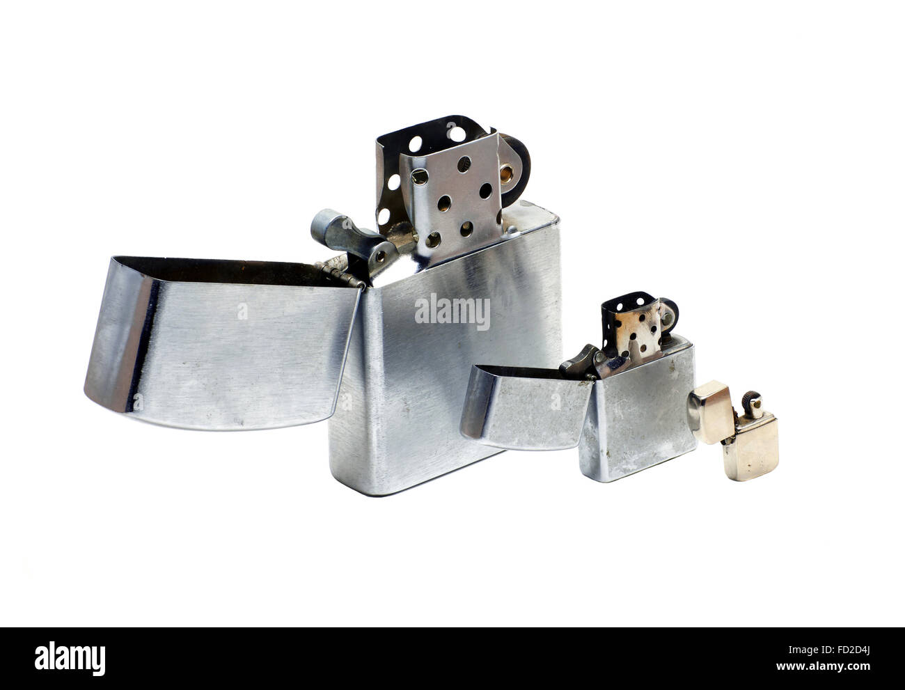 Three different sizes of metallic lighters with cap opened Stock Photo ...