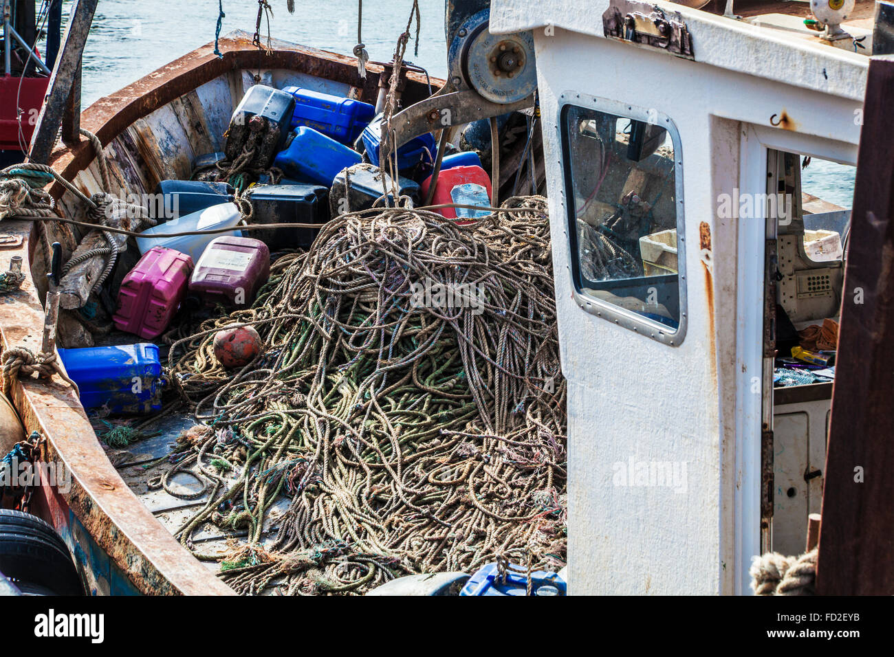 The clutter of fishing paraphernalia in the bow of a fishing boat Stock ...