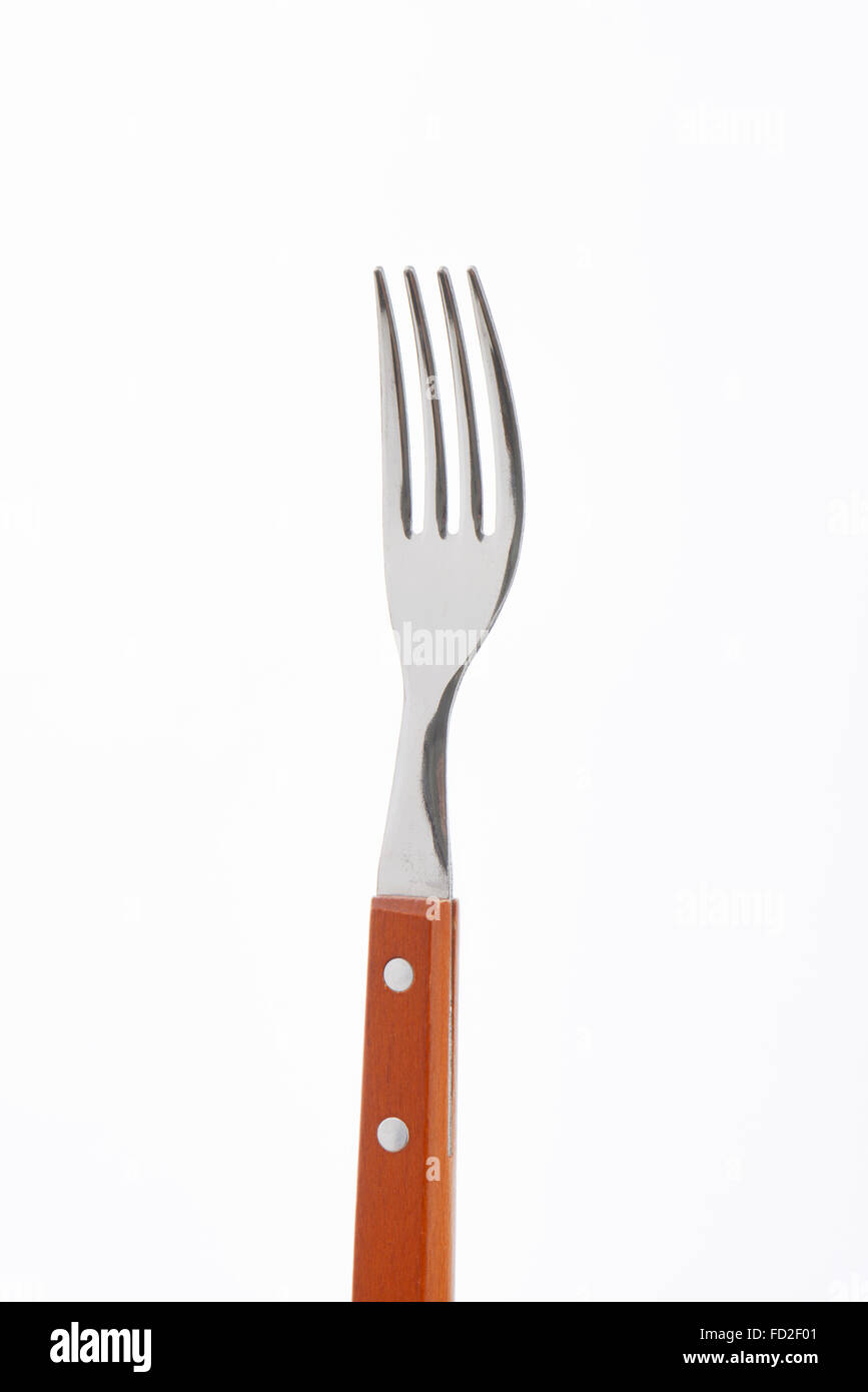 dinner fork with wooden handle Stock Photo - Alamy