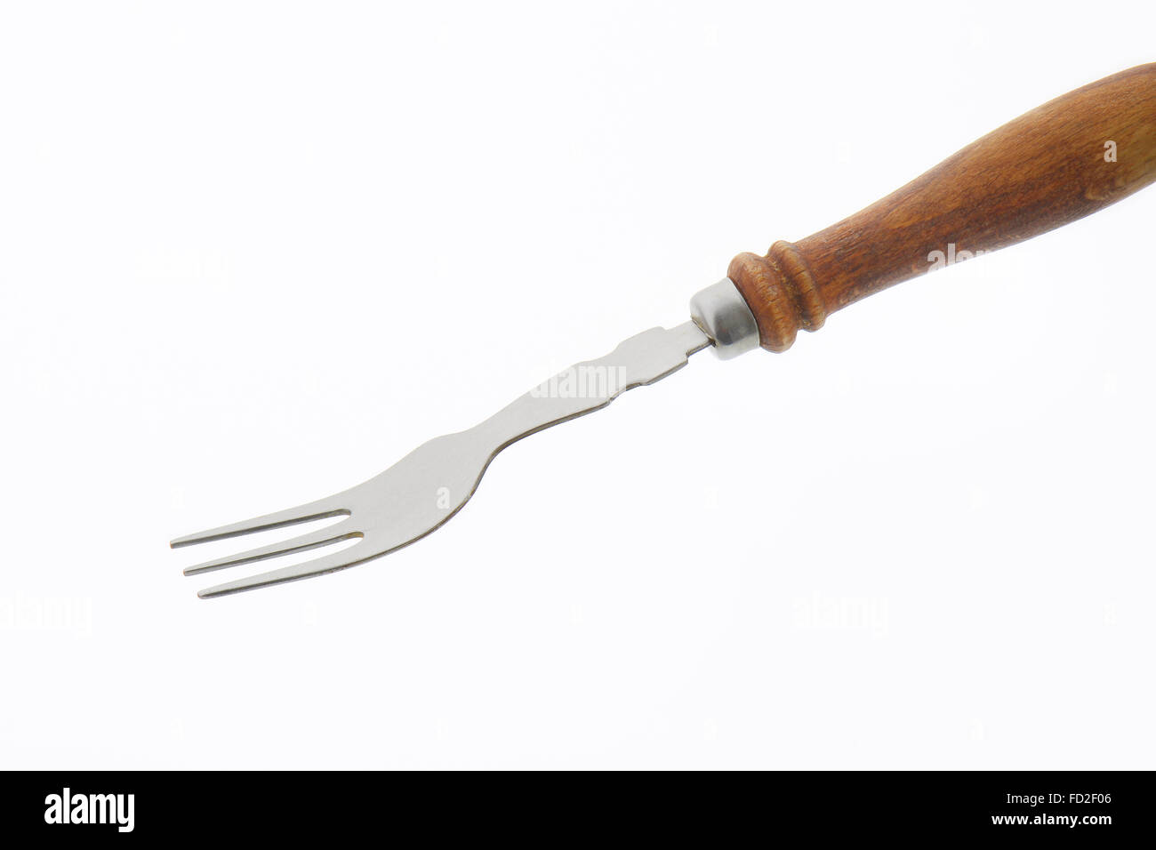 Dessert fork with wooden handle Stock Photo - Alamy