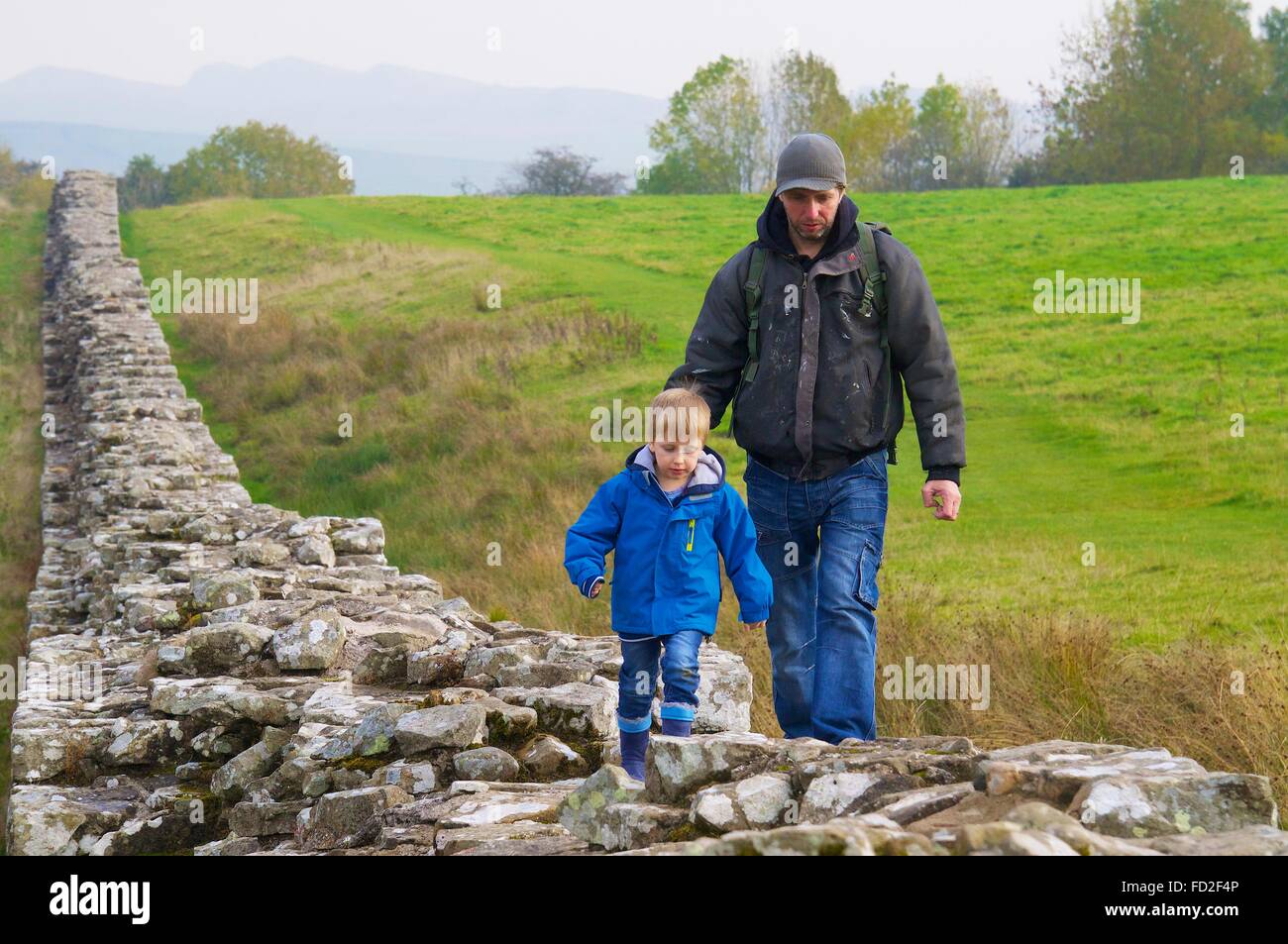 Hadrian's Wall. Father and child walking on the Roman Wall. Birdoswald ...