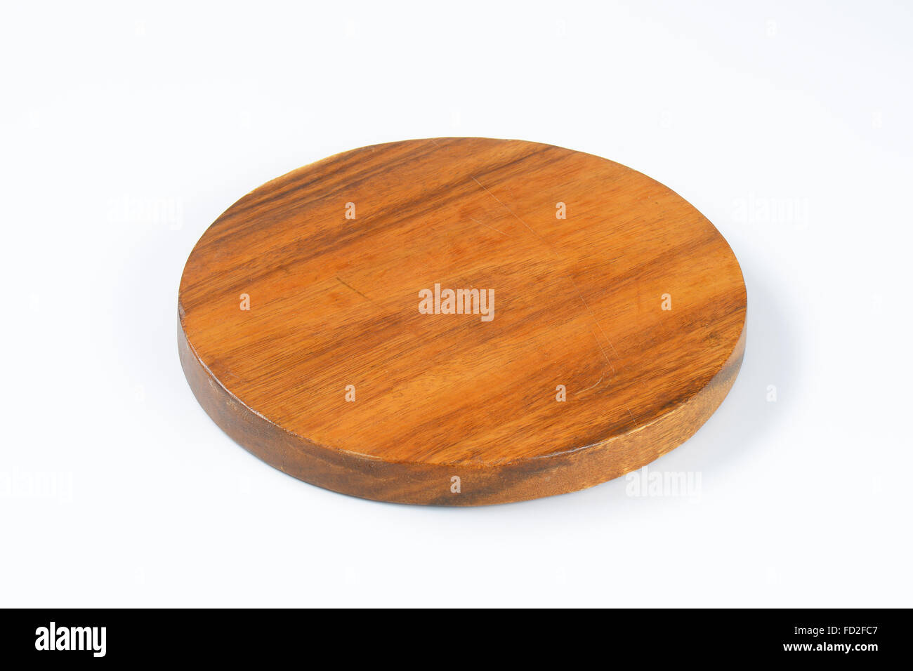 round wood chopping board on white background Stock Photo - Alamy