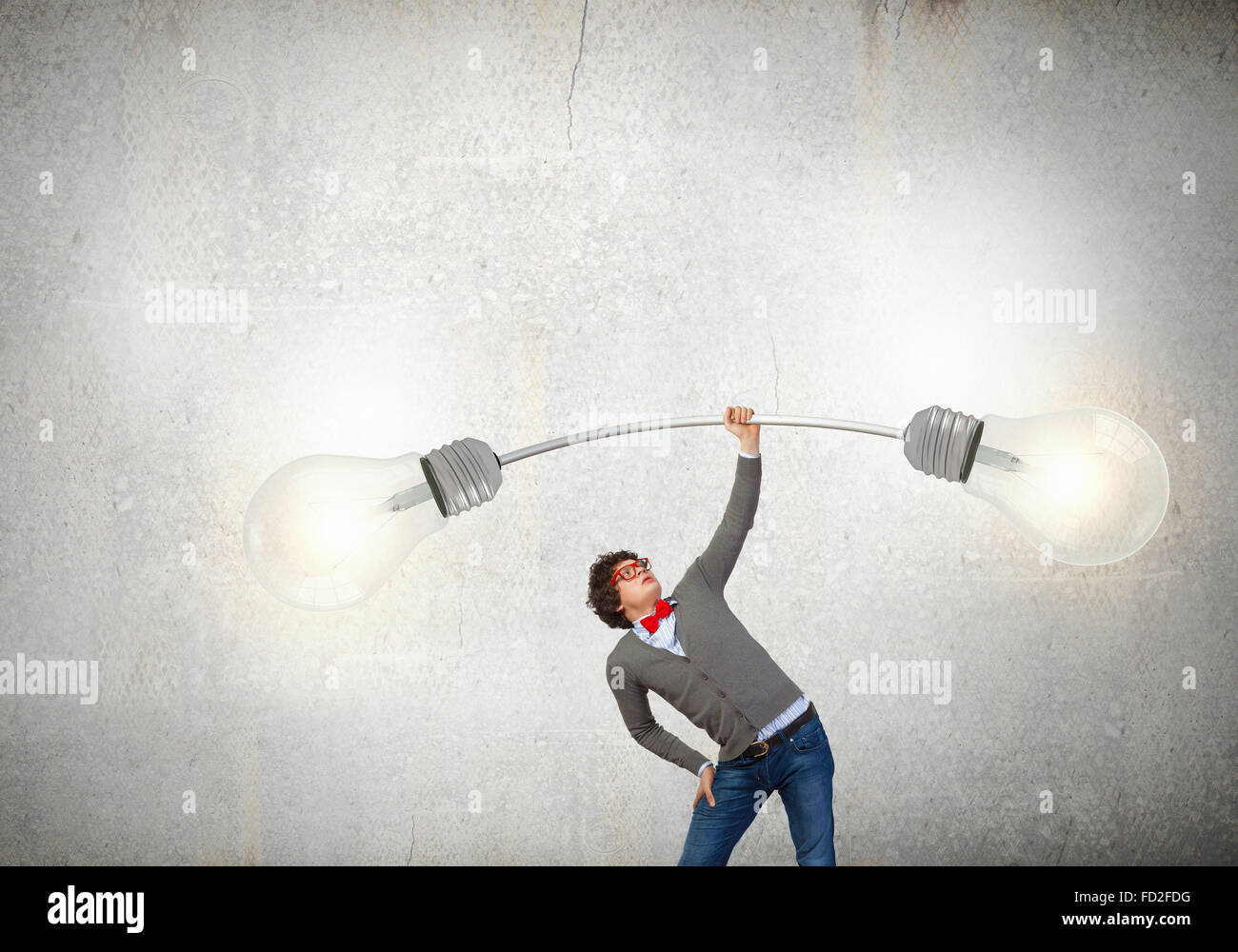 Young strong man lifting barbell on one hand Stock Photo - Alamy