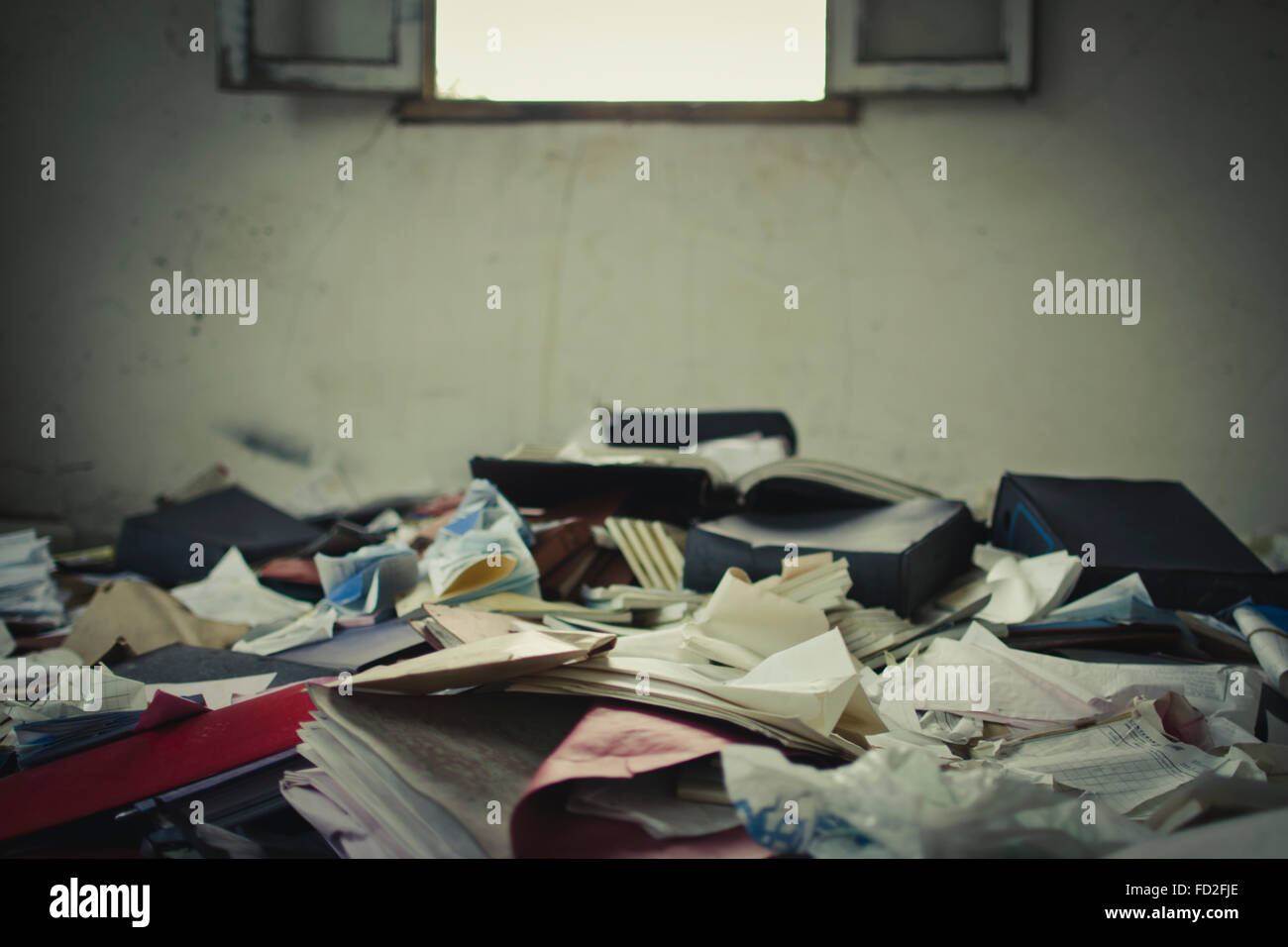 roles in abandoned office floor Stock Photo - Alamy