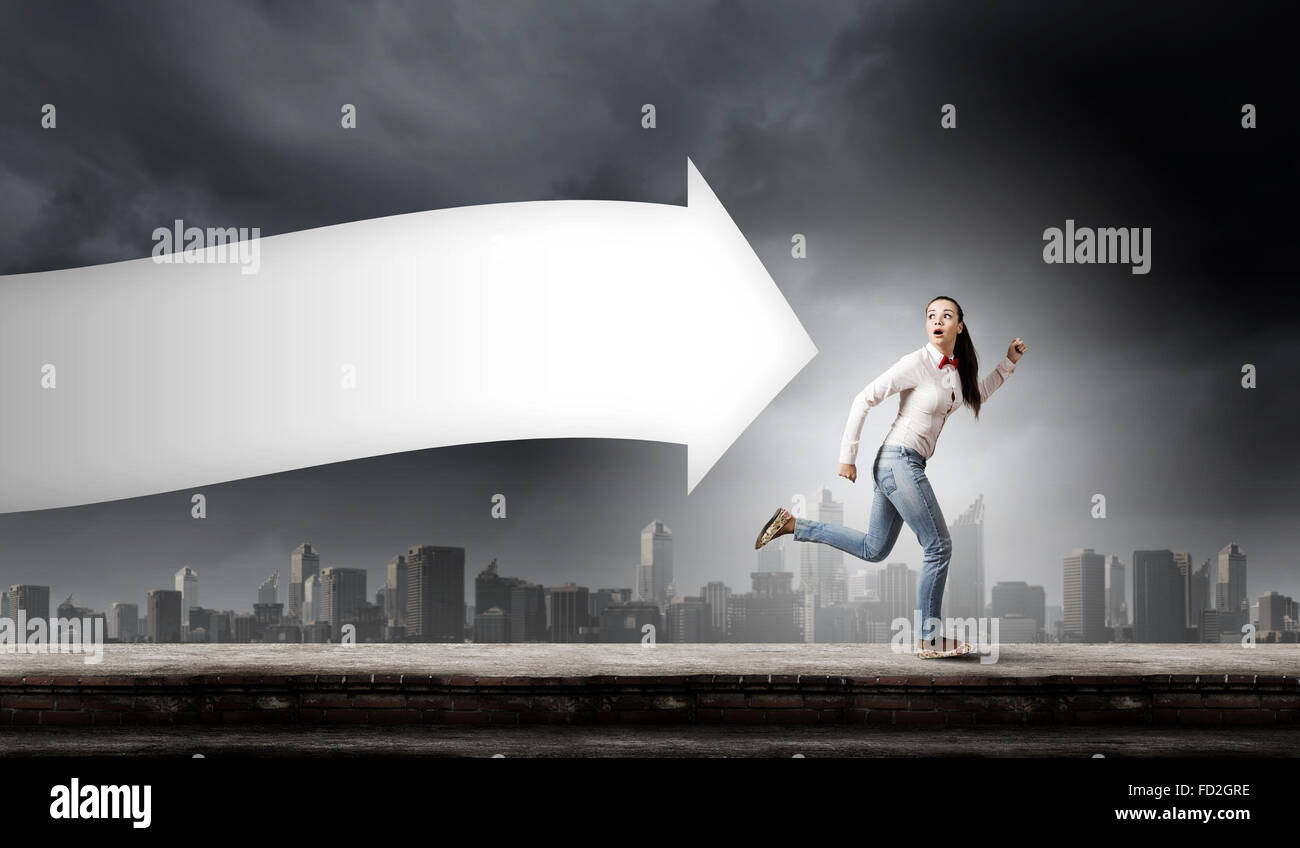 Young funny pretty woman in jeans running in a hurry Stock Photo - Alamy