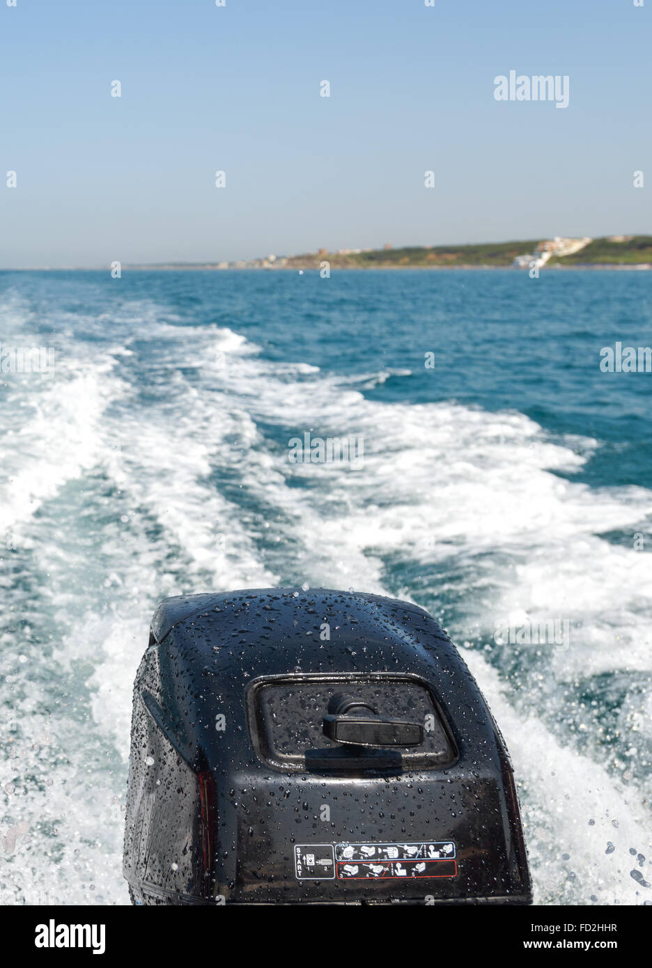 boat running fast leaving a white trail on the blue sea Stock Photo - Alamy
