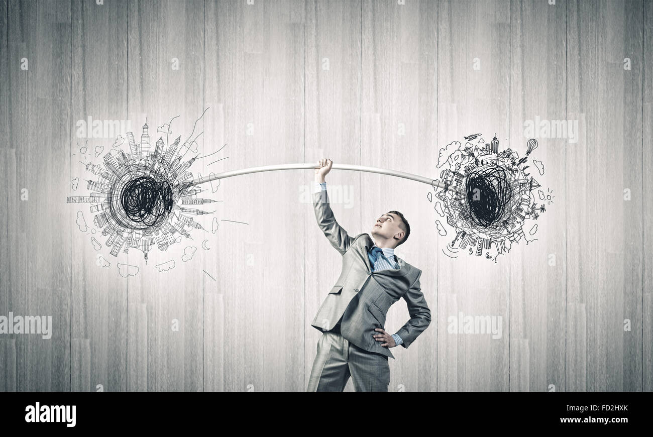 Young strong businessman lifting barbell on one hand hi-res stock ...