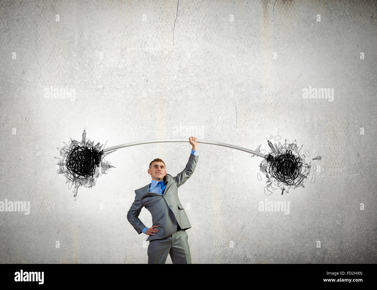 Young strong businessman lifting barbell hi-res stock photography and ...